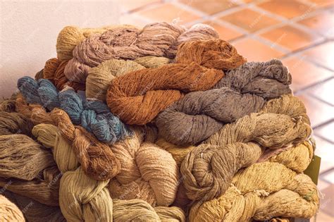 Premium Photo Pile Of Natural Color Dyed Cotton Yarn For Weaving In
