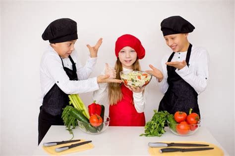 Three Young Chefs Evaluate A Salad Isolated Stock Image Image Of Cook Cute 85334139