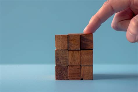 Premium Photo Wooden Cube Puzzle Solution For Business Success Plan Concept