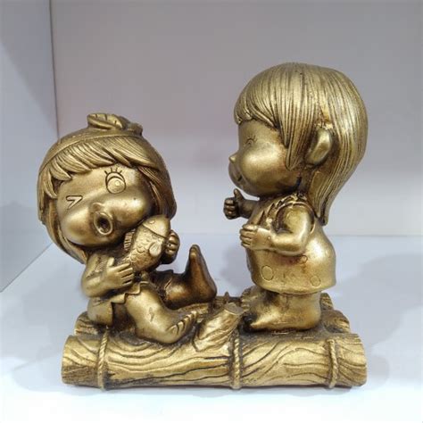 خرید و قیمت مجسمه دکوری دختر و پسر قایق سوار ماهیگیر طلایی از غرفه