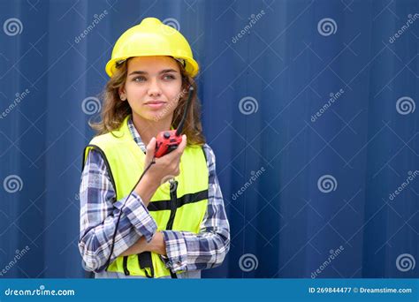 Container Operators Women Wearing Helmets And Safety Vests Control Via Walkie Talkie Workers In