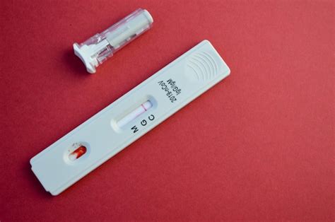 Premium Photo Test For Coronavirus Lies On A Red Background Sensitive
