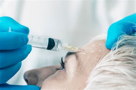Premium Photo Woman Having Botox Injected In Her Face