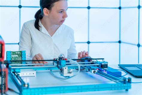 Babegirl At A Physics Lesson Working With An Optical Measuring Device In A Babe Laboratory