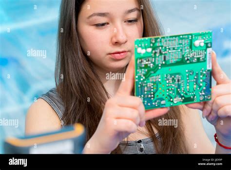 Babe Girl In Electronics Laboratory Experiment With Microcontroller And Robot Cnc Module
