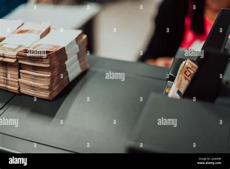 Sorted Banknotes Placed On The Table After It Is Counted On The Electronic Money Counting