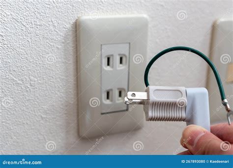 A Japanese Wall Socket Without Earth Post Power Plug Connected To A Adapter Stock Photo