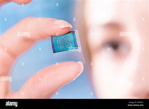 Technician Examining Microchip In Microelectronics Laboratory Stock Photo Alamy