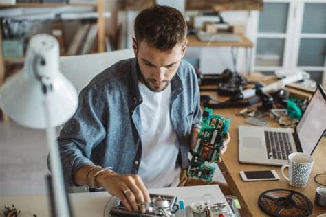 Man Fixing Electronic Circuit Photos By Canva