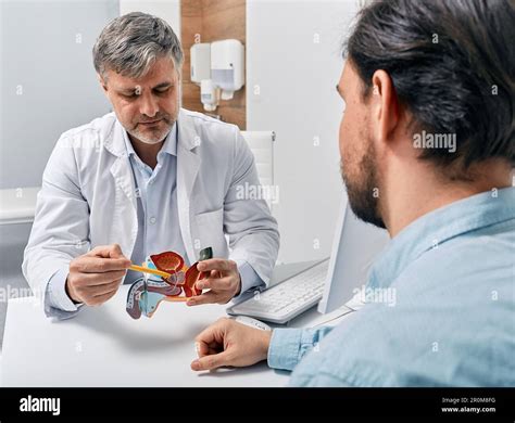 Doctor Urologist Consulting Patient With Prostatitis Explaining To Him Methods Of Treatment