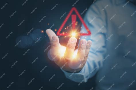 Premium Photo Red Triangle Caution Warning Signs On The Hand Of Businessman For Risk