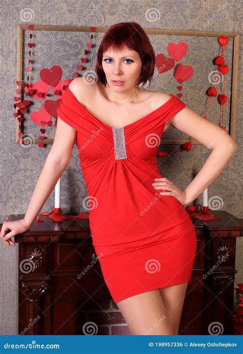 Legged Redhead Model In Red Minidress Posing In Studio Stock Photo Image Of Pretty High