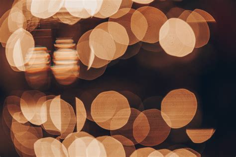 Download Aesthetic Light Brown Bokeh Lights Wallpaper