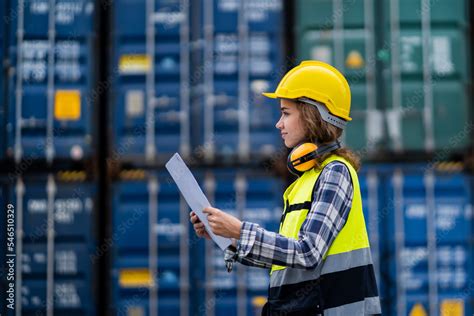 Female Engineer Checking Safety In A Large Port Warehouse Female Worker Working In A Safety