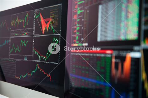 Two Monitors Of Computers With Charts And Graphs In Office Royalty Free Stock Image Storyblocks