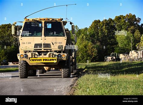 U S Army National Guard Dump Trucks And Other Government Vehicles Line The Road In Front Of The