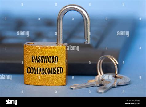 Password Compromised Text Engraved On Padlock With Blurred Keyboard Background Password