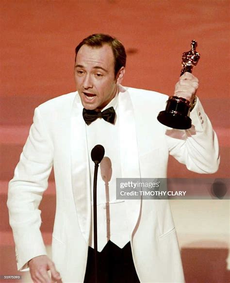 Kevin Spacey Holds Up His Oscar After Winning Best Supporting Actor