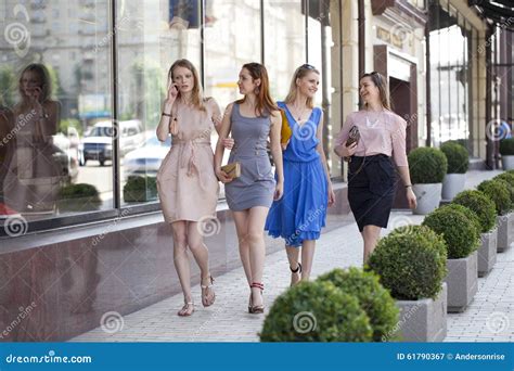 Four Beautiful Fashion Girls Walking On The Street Stock Image Image