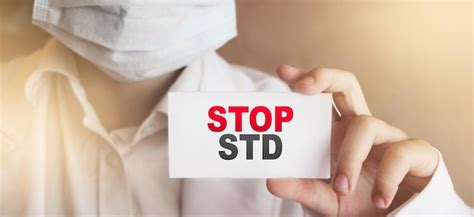Premium Photo Doctor Holding A Card With Text Stop Std Medical