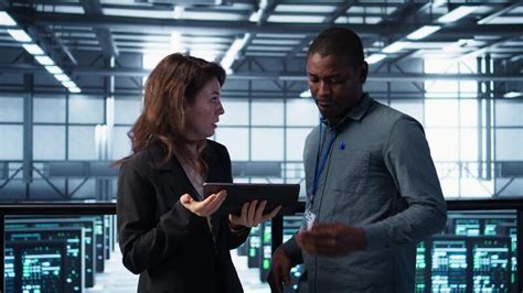 Computer Scientists In Data Center Using Tablet To Develop Disaster