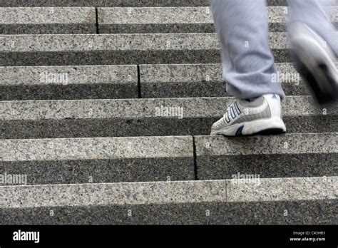 The Legs Of A Male Walking Up Some Steps Stock Photo Alamy