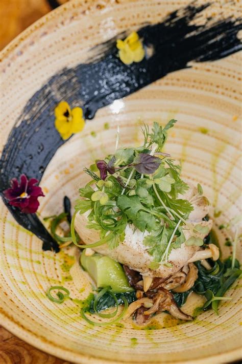 Poached Cod Fillet With Salad Mushroom And Cucumber Served In Dish Isolated On Table Side View