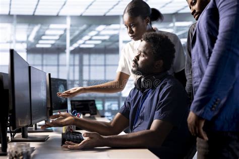 group of server hub employees working together on debugging code stock