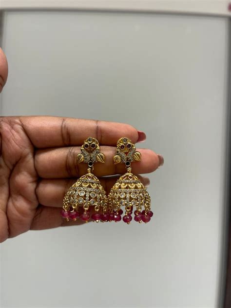 Dual Peacock Gold Jhumkas Alluring Accessories