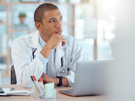 Premium Photo Doctor Man Is Thinking With Healthcare And Medical Problem Solving With Research