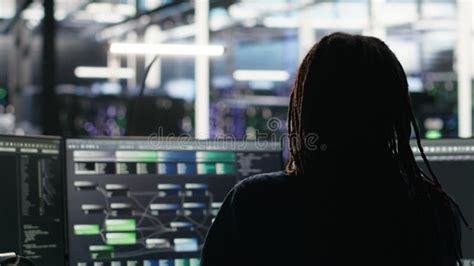 Data Center Engineer Using Algorithms To Analyze Datasets Putting On