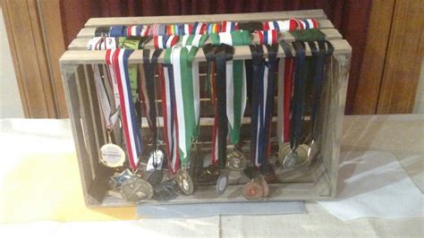 Graduation Display With Medals In Case