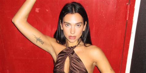 Dua Lipa Brings Back Sheer Stockings In A Glam Satin Cutout Dress