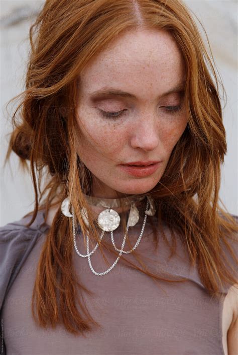 Redhead Looking Down By Stocksy Contributor Rene De Haan Stocksy