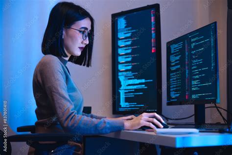 asian woman software development working on coding computer screen and