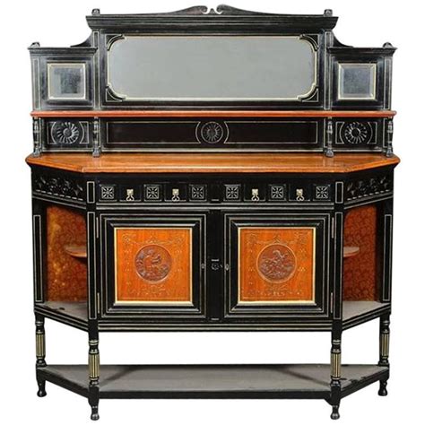 Bruce Talbert Attr An Ebonised Side Cabinet Carved With Putti Playing The Lute For Sale At 1stdibs