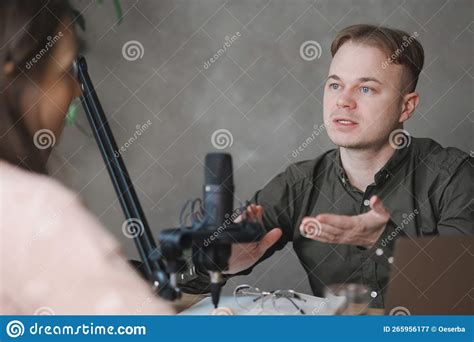 Record Podcast In Recording Studio Man And Woman Do Interviews Or Create Audio Content In