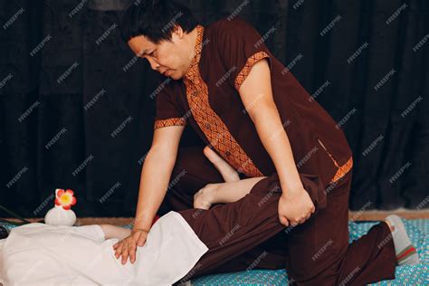 Premium Photo Thai Man Making Classical Thai Massage Procedure To