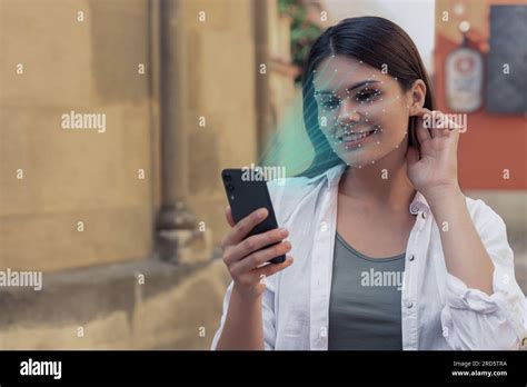 Woman Using Smartphone With Facial Recognition System On Street Security Application Scanning