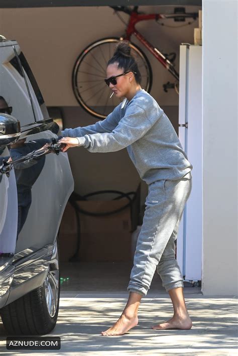 John Legend And Chrissy Teigen Leave A Box Of Krispy Kreme Donuts For The Paparazzi At Their