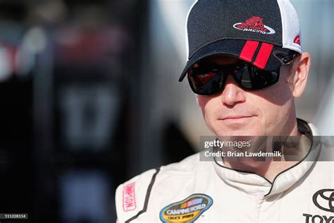 Timothy Peters Driver Of The Red Horse Racing Toyota Stands In The