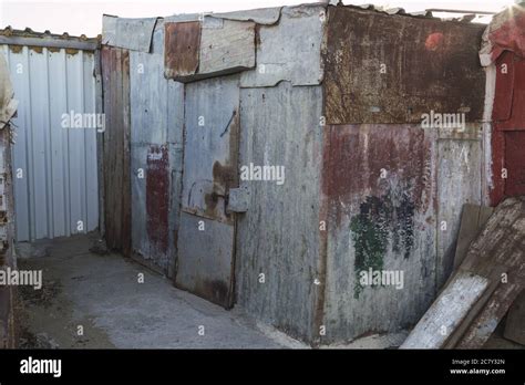 Abandoned Garage Covered With Old Rusty Tin Sheets And Slate Stock Photo Alamy