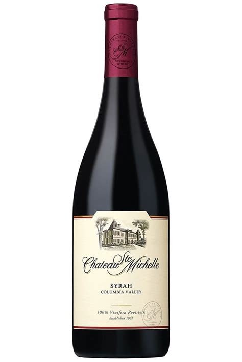 A Bottle Of Red Wine Sitting On Top Of A Table
