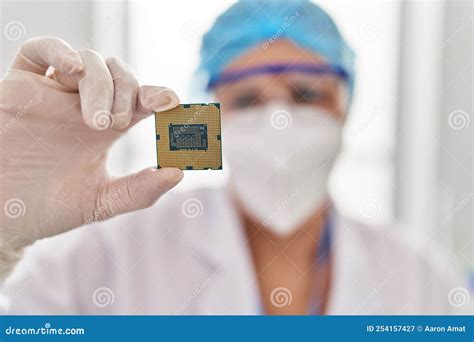 Middle Age Woman Wearing Scientist Unifor And Medical Mask Holding Cpu Middle Age Woman Wearing Scientist Unifor And Medical Mask Holding Cpu