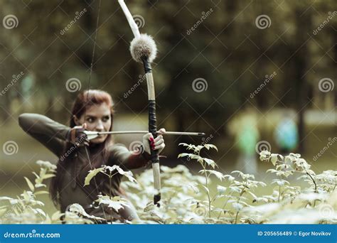Archer Woman Shooting The Bow And Arrow In The Swamp Stock Image Image Of Autumn Aggressive