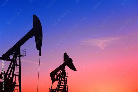 Pumping Unit Is Working In Oil Field Of The Sunset Stock Photo Adobe Stock