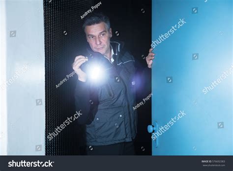 Male Security Guard Using Flashlight Checking Stock Photo Shutterstock