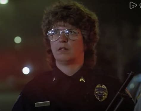 The Cop With The Permed Mullet Glasses And Shotgun Watching In Awe As