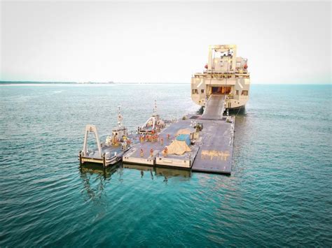 Improved Navy Lighterage System Inls Craft Connects To The Offloading Ramp Of A Military