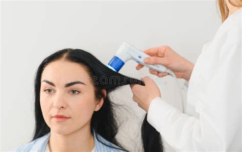 A Close Up Image Of A Person Undergoing A Scalp Examination With A